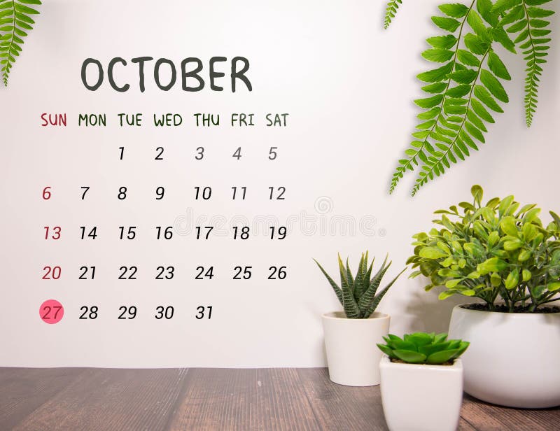 Wooden Calendar with the Date October 27 on Desktop with Laptop Stock ...