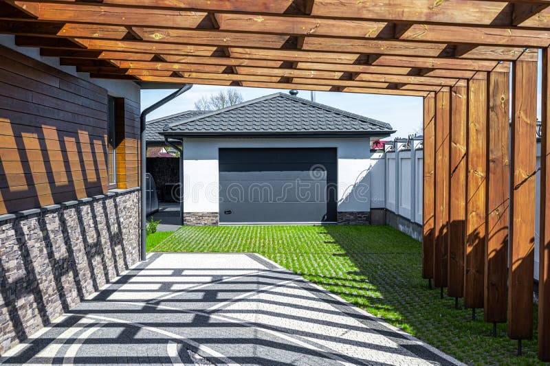 Wooden Canopy in Front of the Garage Stock Photo - Image of facade ...