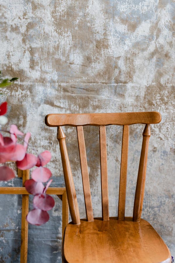 Wooden Chair in Studio Room with Flowers Stock Photo - Image of space ...