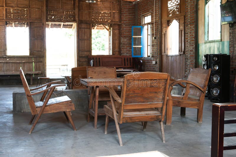 Wooden Chairs Sit Around a Wooden Table Stock Image - Image of elegant ...
