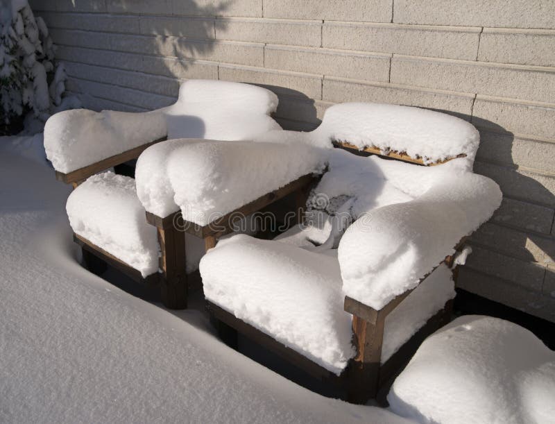 Wooden chairs with snow stock photo. Image of covered - 22498376