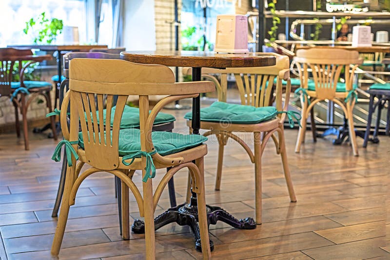 Wooden Chairs with a Table in a Modern Cafe Interior. Stock Image ...
