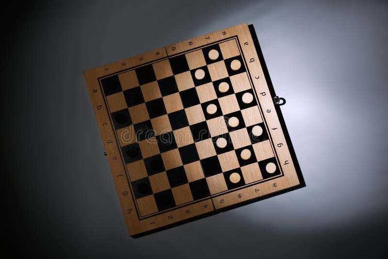 Wooden Checkerboard with Game Pieces on Grey Background, Top View Stock ...