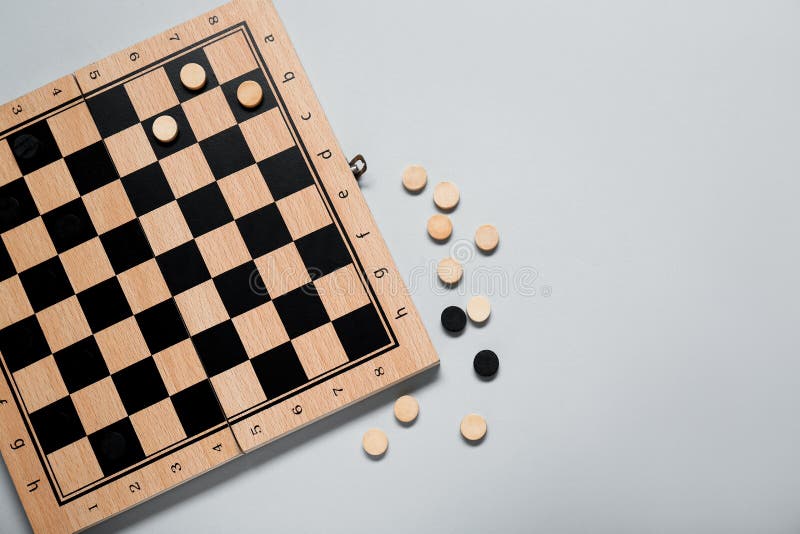Wooden Checkerboard and Game Pieces on Light Grey Background, Flat Lay ...