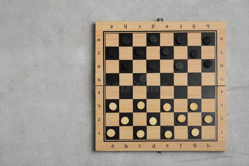 Wooden Checkerboard with Game Pieces on Light Grey Background, Top View ...