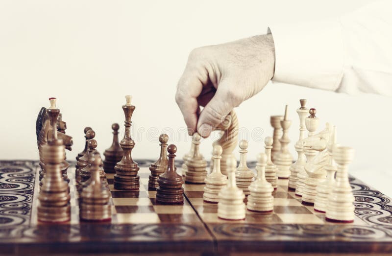 Wooden Chess Pieces on a Chessboard, Chess Game Player Makes a Move ...