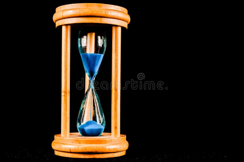 A Wooden Clock with a Blue Face and Sand Inside Stock Photo - Image of ...