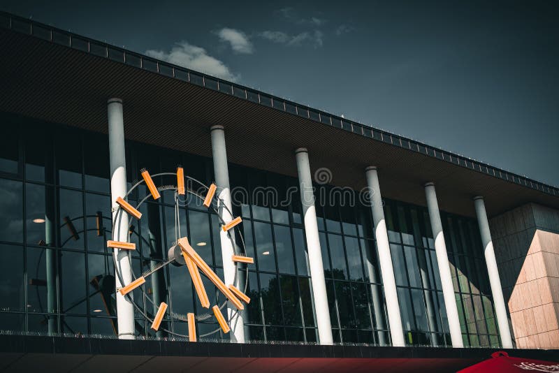 Wooden Clock in Front of a Modern Train Station during Daytime ...