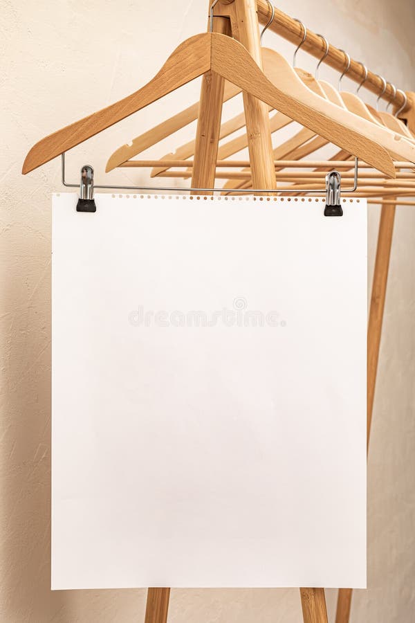 Wooden Clothes Hanger and Empty Poster Displayed on a Bamboo Rack ...