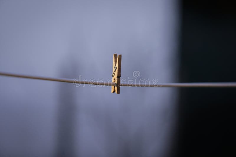 Wooden Clothes-pin Hanging on a Wire Stock Photo - Image of retro, wire ...