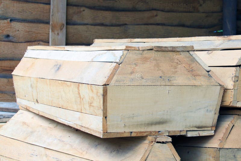 Wooden coffins in stock stock image. Image of burial - 61684157