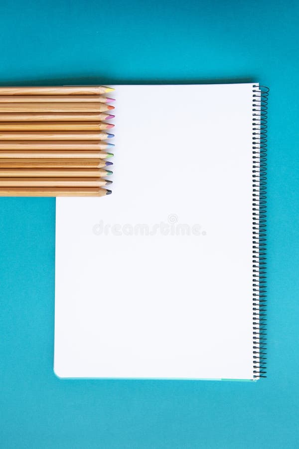 Colored Pencils on Blank Page of a Notebook Stock Image - Image of ...
