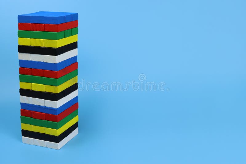 Wooden Colored Tower Blocks Game on Blue Background. Copy Space for ...