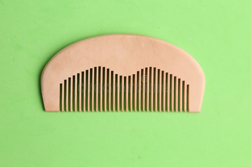 Wooden Comb on a Green Surface Stock Photo - Image of style, wooden ...