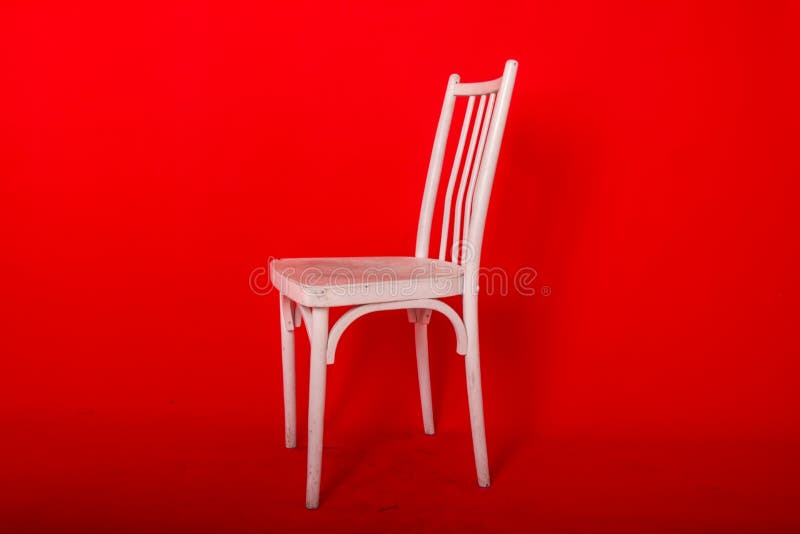 Wooden Comfortable Chair Highlighted on a Red Background Stock Photo ...