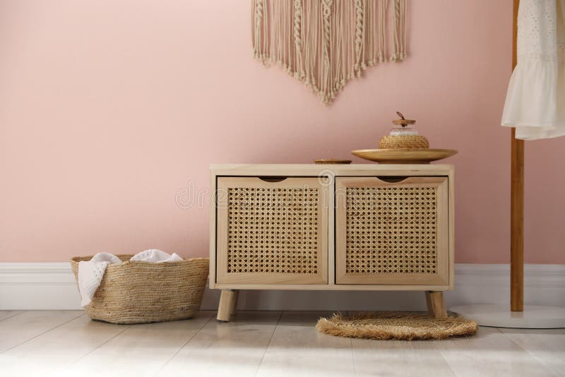 Wooden Commode Near Pink Wall in Room. Interior Design Stock Photo ...