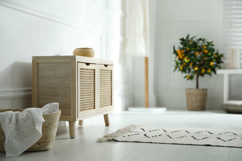 Wooden Commode Near White Wall in Room. Interior Design Stock Photo ...