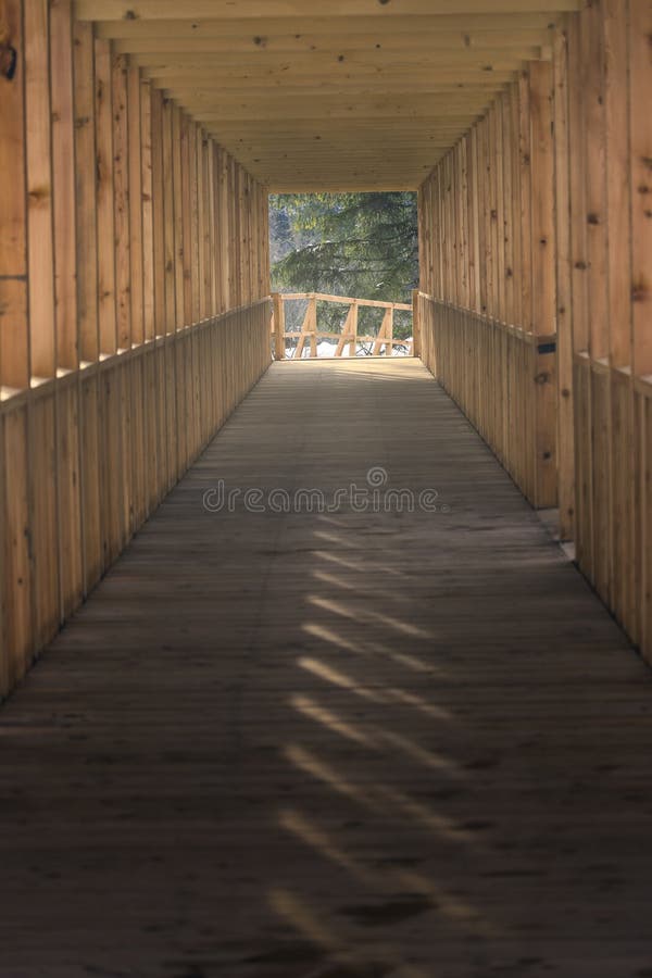 Wooden Construction Across the Glacial River. Modern Bridge Made of ...