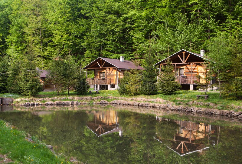 Wooden cottage in forest stock image. Image of cottage - 24323567