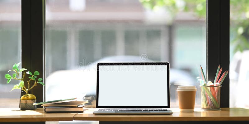 Wooden Counter Bar is Surrounding by a Computer Laptop and Personal ...