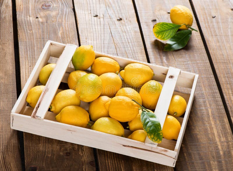 Lemons in Wooden Crate stock image. Image of farm, harvest - 38021519
