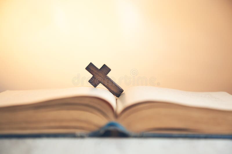 Wooden cross on the book stock photo. Image of book - 207745536
