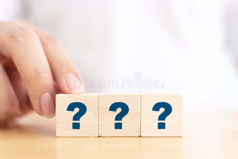 Wooden Cube Block Shape with Sign Question Mark Symbol on Wood Table ...