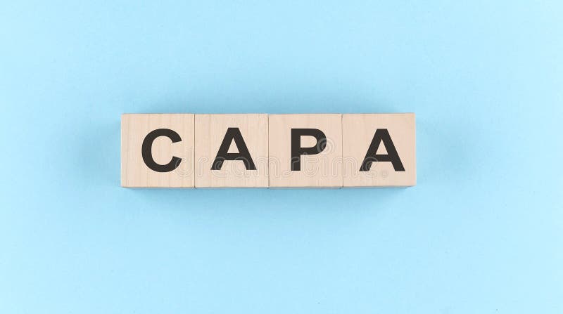Wooden Cube Block with Text CAPA on the Blue Background Stock Image ...