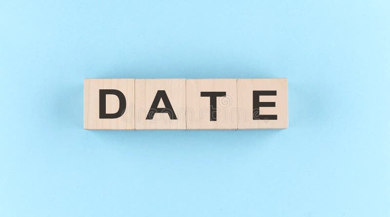 Wooden Cube Block with Text DATE on the Blue Background Stock Photo ...