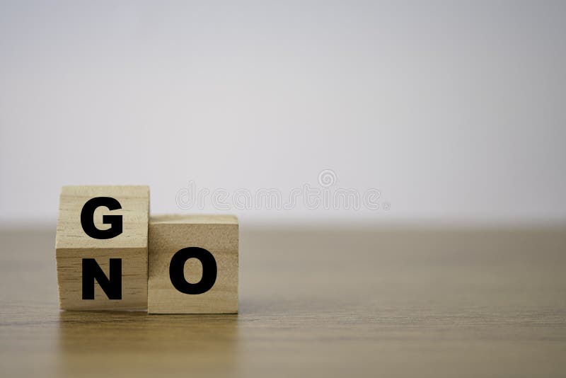Wooden Cube Flipping for Change between Go and No Stock Image - Image ...