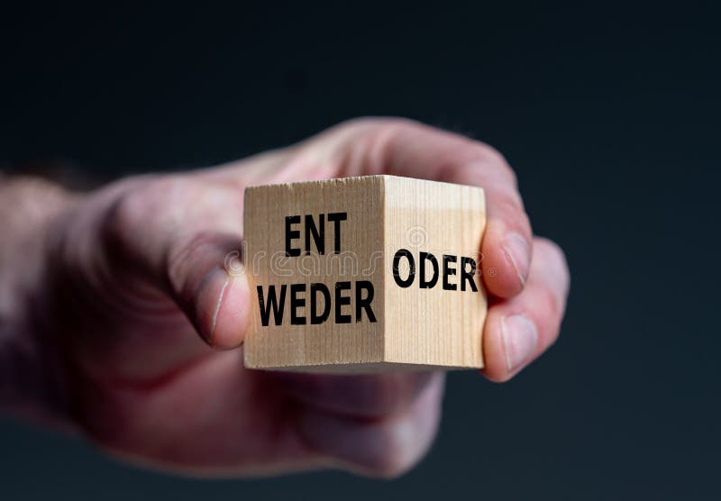 Wooden Cube with the German Words Entweder (either) and Oder` (or ...