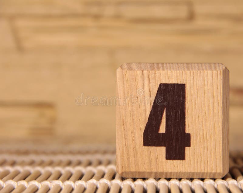 Wooden Cube with the Number Four on a Beige Background Stock Image ...