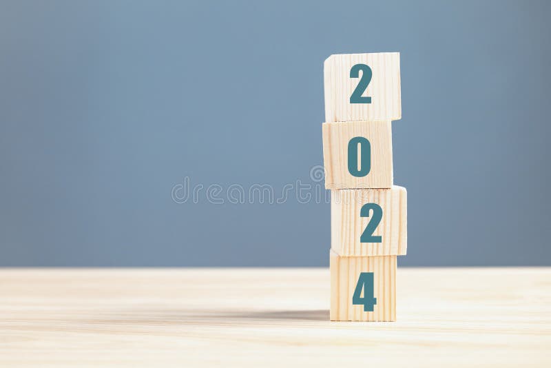 2024 on Wooden Cube Stack Blocks on the Table. Start a Happy New Year ...