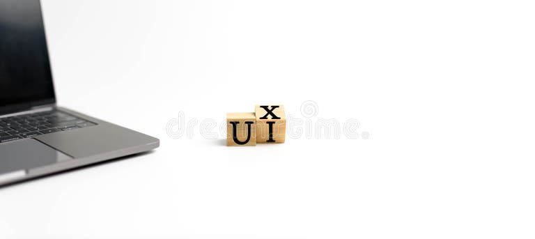 Wooden Cube on a White Table with Text UX, UI. Concept of Development ...