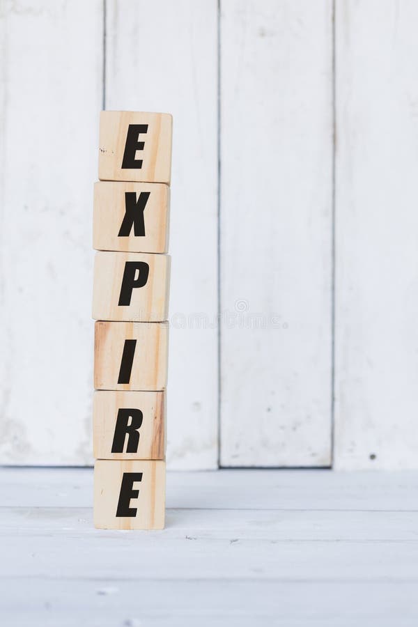 Wooden Cube, with the Word Expire, with White Wooden Background Stock ...