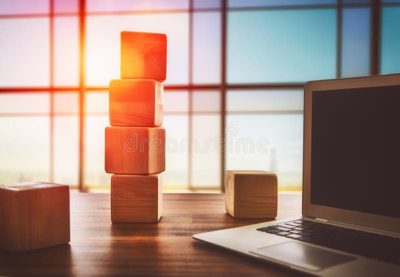 Wooden cubes and computer stock photo. Image of finance - 66725724