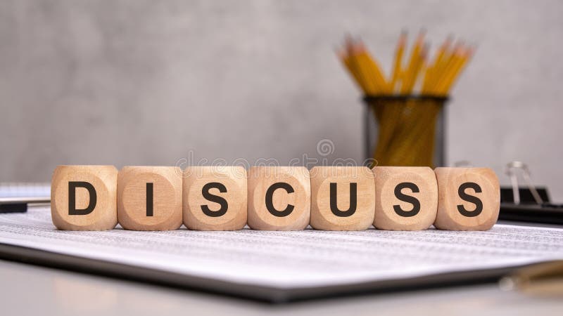 Wooden Blocks Spell "DISCUSS" on Documents, Symbolizing Conversation ...