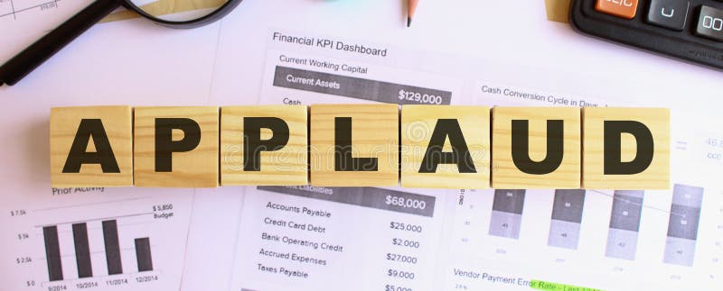 Wooden Cubes with Letters on the Table in the Office. Text APPLAUD ...