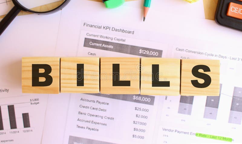 Wooden Cubes with Letters on the Table in the Office. Text BILLS Stock ...