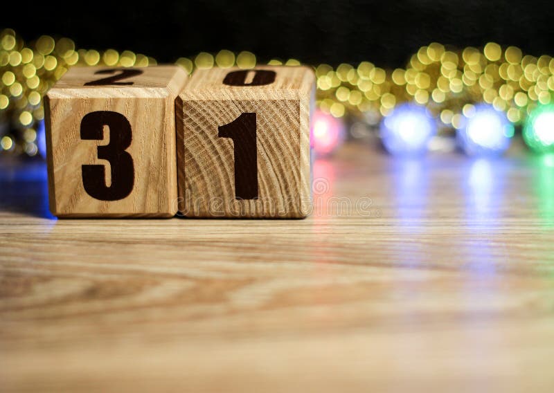 Wooden Cubes with the Number 31 on a Dark Background with Bright Lights ...