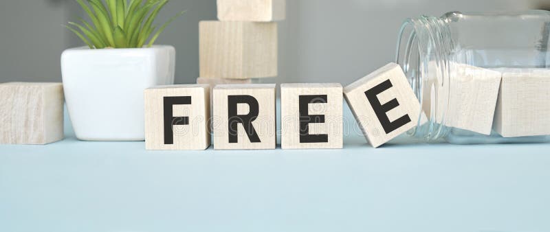On Wooden Cubes Text FREE on the Blue Table Stock Image - Image of wood ...