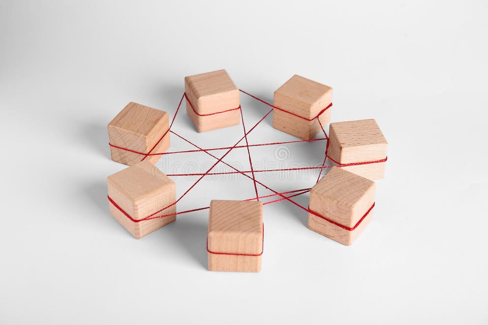 Wooden Cubes Tied with Red Thread on Light Background. Unity Concept Stock Image - Image of ...