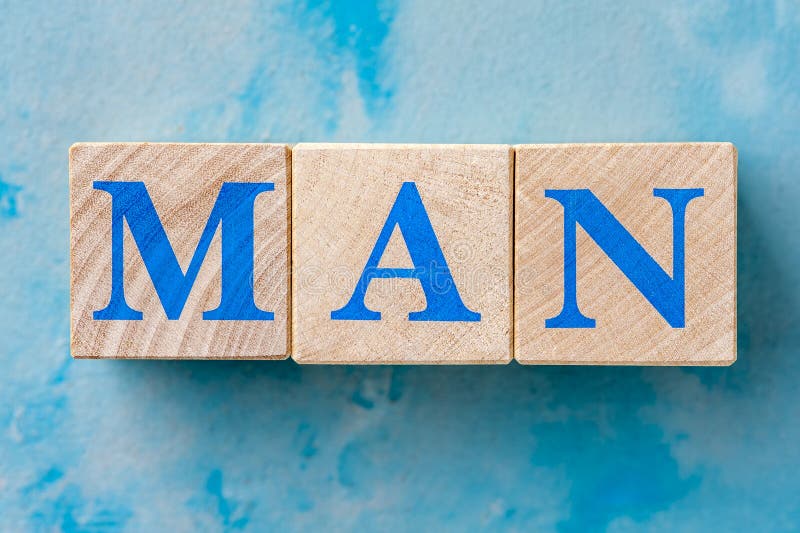 Wooden Cubes with Word MAN on Blue Table. Stock Image - Image of ...