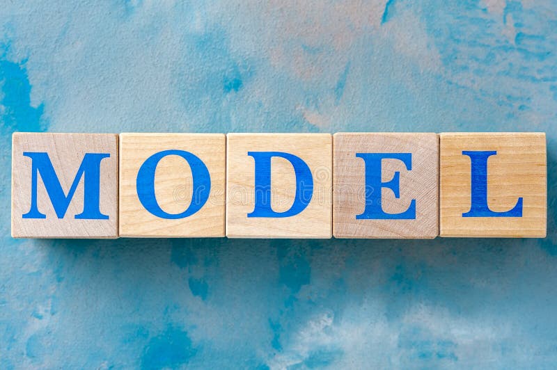 Wooden Cubes with Word MODEL on Blue Table. Stock Photo - Image of ...