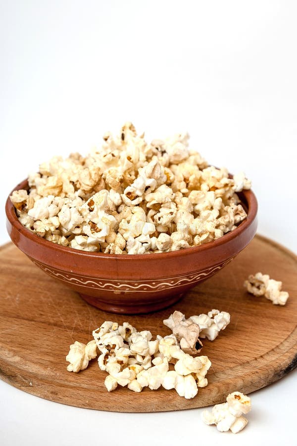 Wooden Cutting Board, Clay Bowl Full of Popcorn, Some Scattered Stock ...