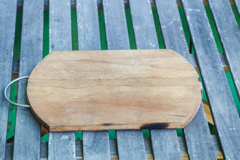 Wooden Cutting Board on Table Stock Photo - Image of closeup, cutting ...