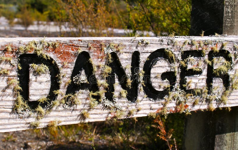 Wooden Danger Sign Covered by Moss Stock Photo - Image of nature ...