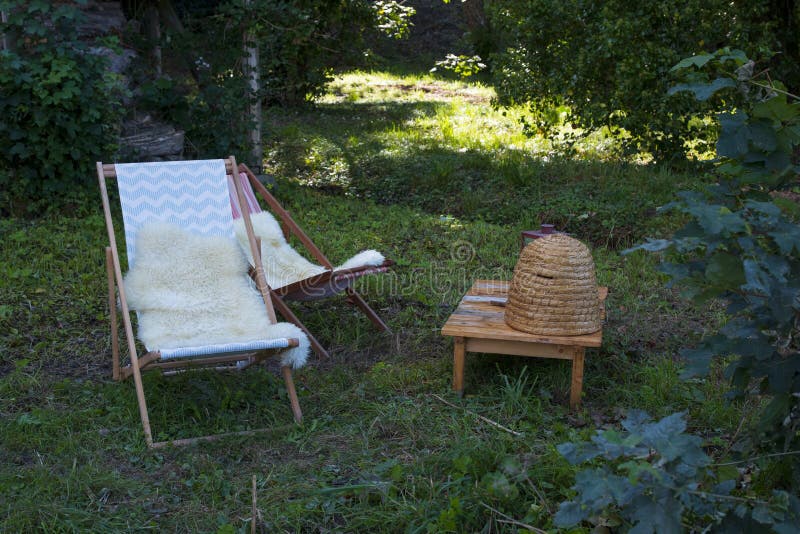 Wooden Deck Chair in the Forest, Romantic with Beehive Stock Photo ...