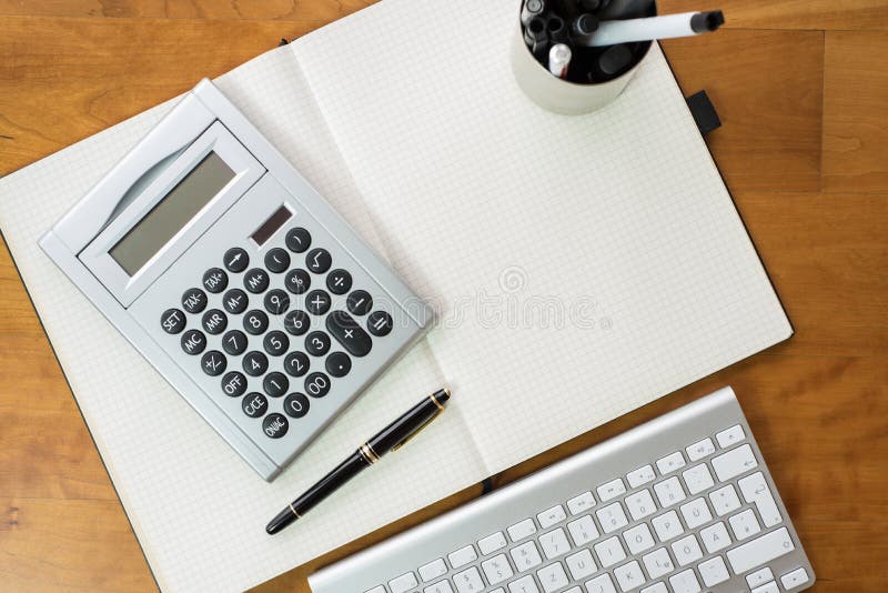 Wooden Desk with Keyboard, Smartphone, Calculator and Notebook Stock ...