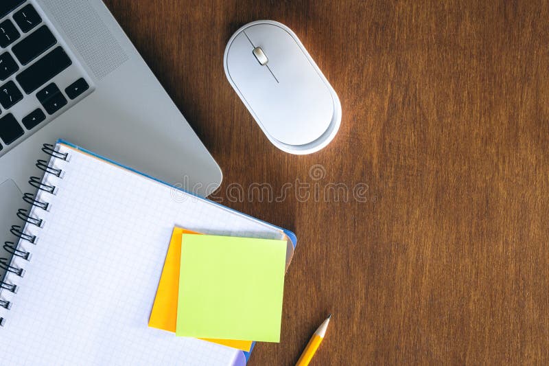 Wooden Desk with Laptop, Notebook and Computer Mouse on the Table, Top ...